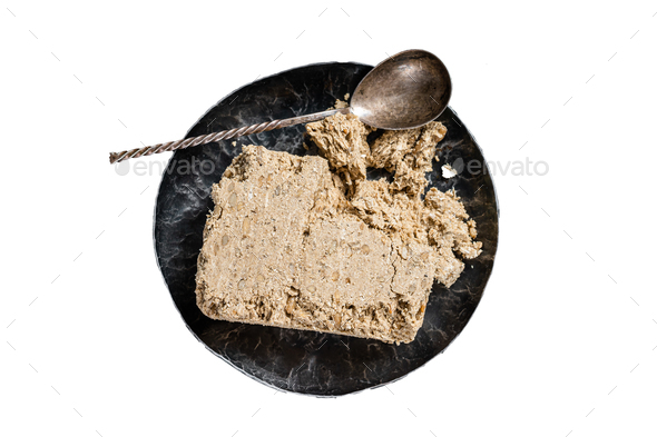 Homemade sunflower halva with honey. Isolated on white background. Stock Photo by composter-box